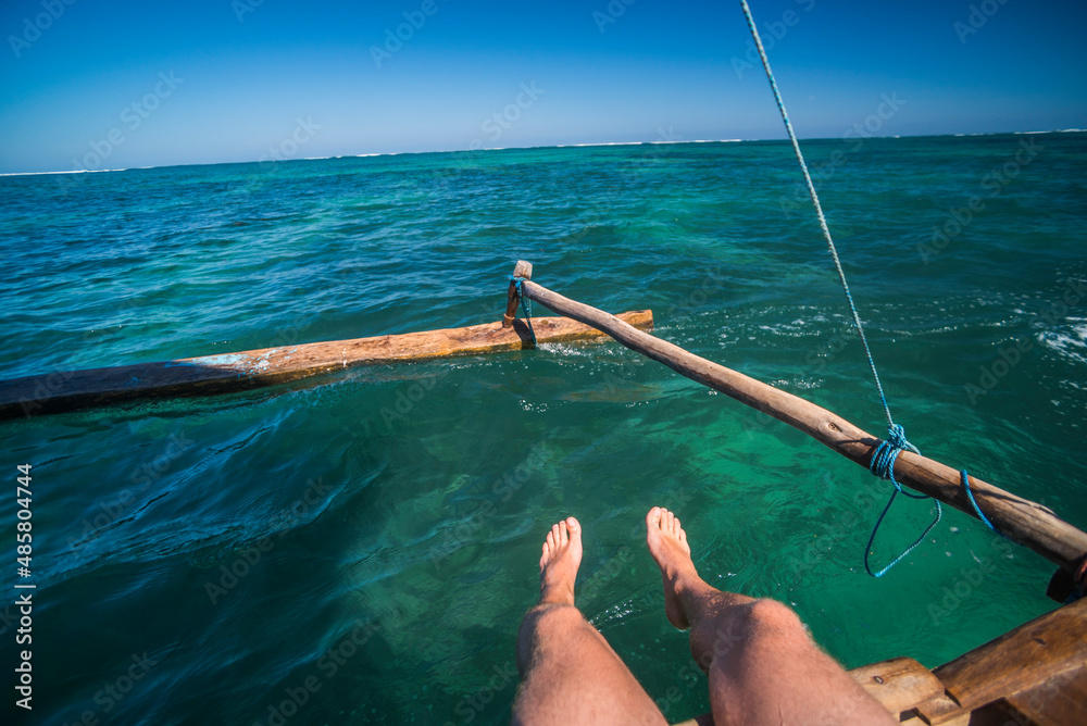 Tourist on a Pirogue, a traditional Madagascar sailing boat using a ...