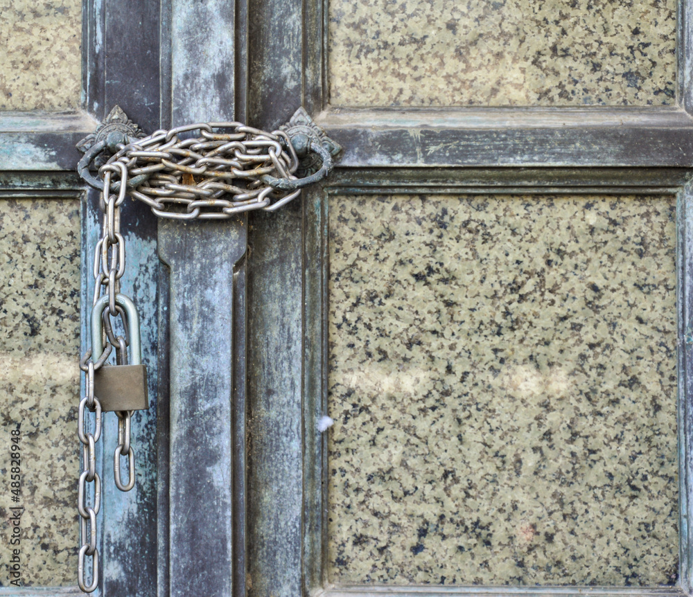 Chained door, locked with a key. Restricted area concept. Cross in ...