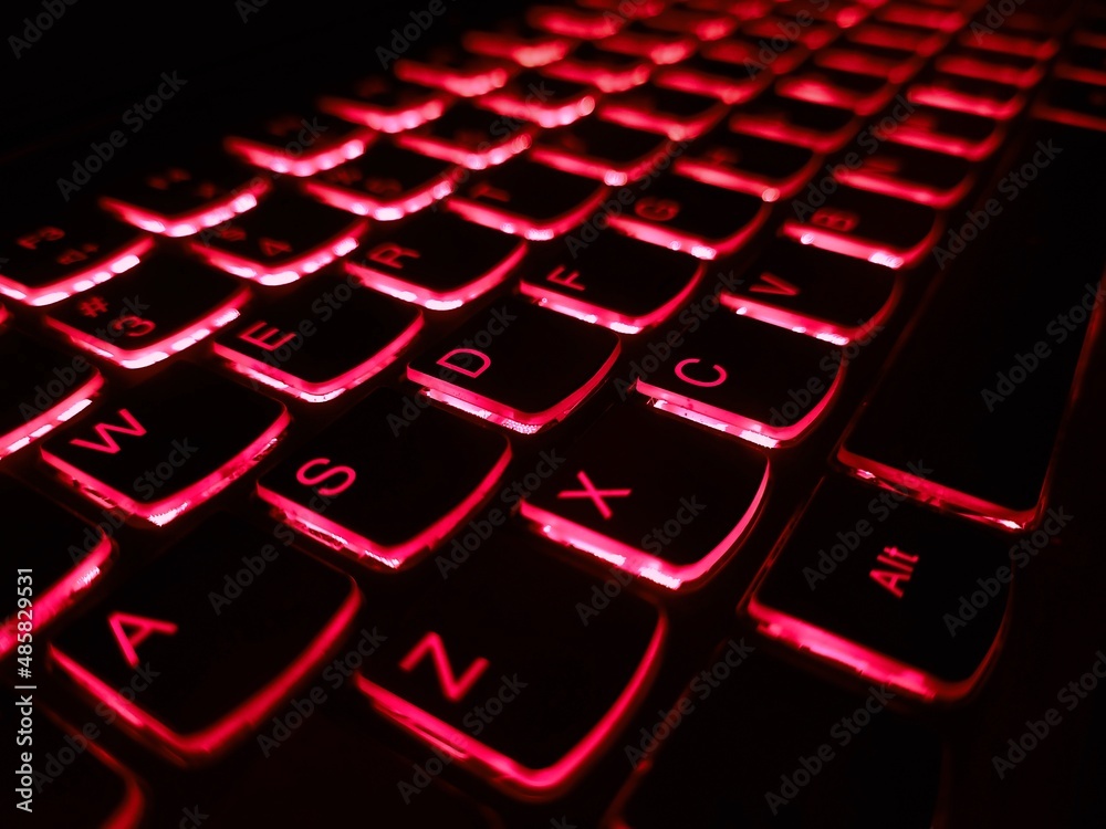 Colse up for RGB Keyboard. A blue light ambient keyboard. Bright ...