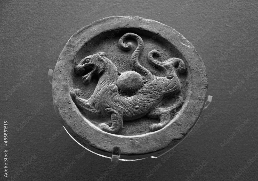 Circular tile animal totem carving in Han Dynasty of China Stock Photo ...