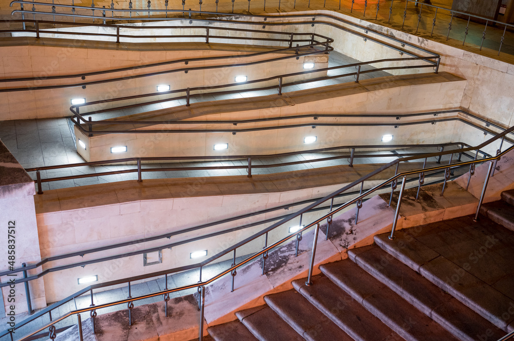 Large access ramp to a building for disabled people. Safety railing and ...