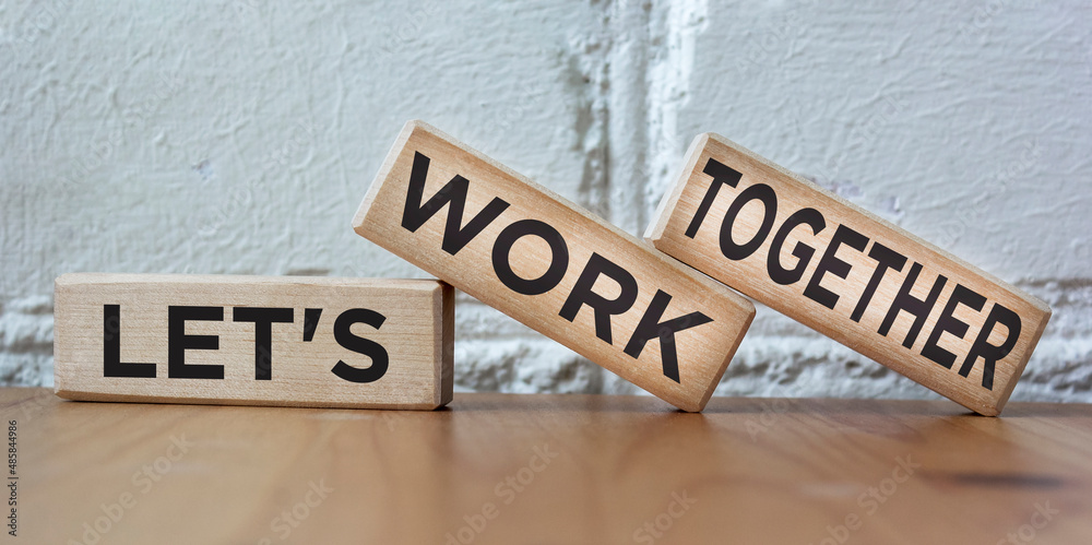 Let's work together words on wooden blocks, against the background of a ...