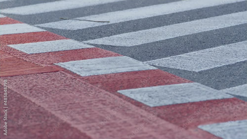 Closeup pedestrian crossing lines on asphalt road. Town movement ...