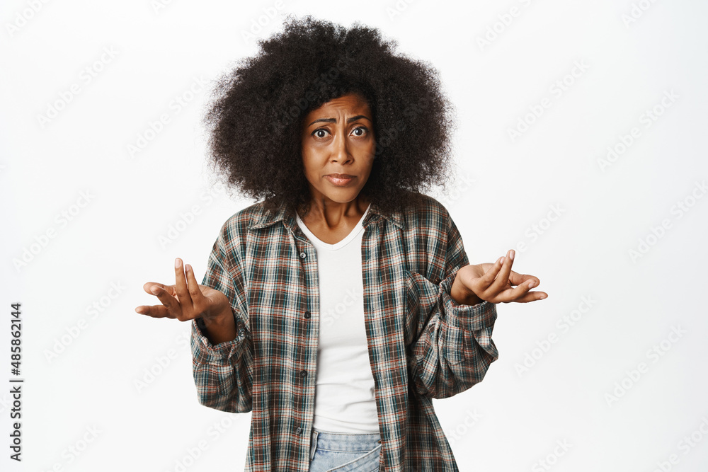 Image of confused and worried Black woman asking question, shrugging ...