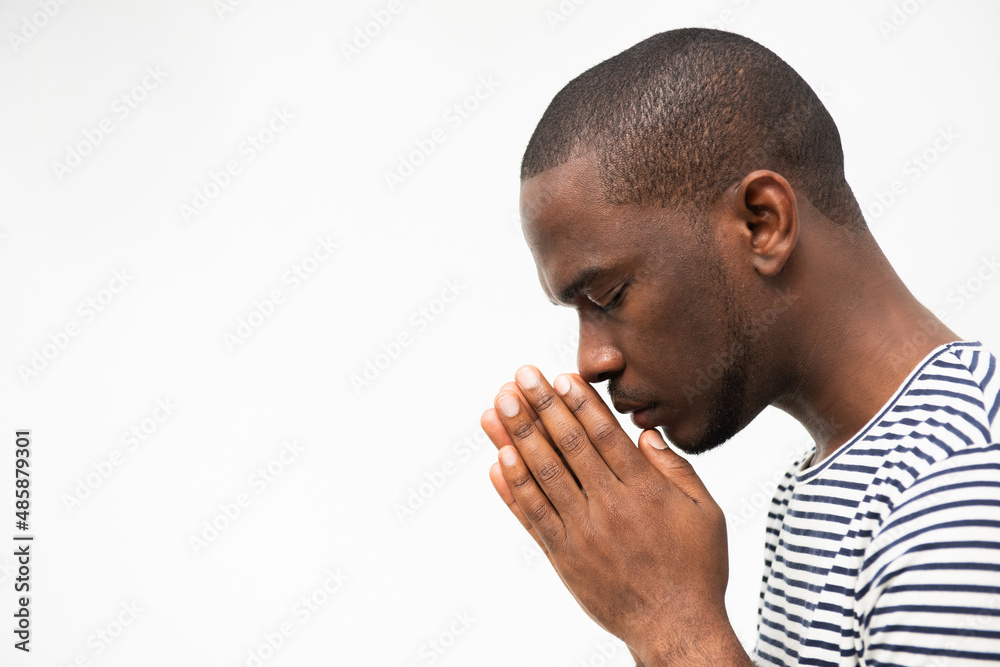 side portrait african american man praying with hands clasp Stock Photo ...