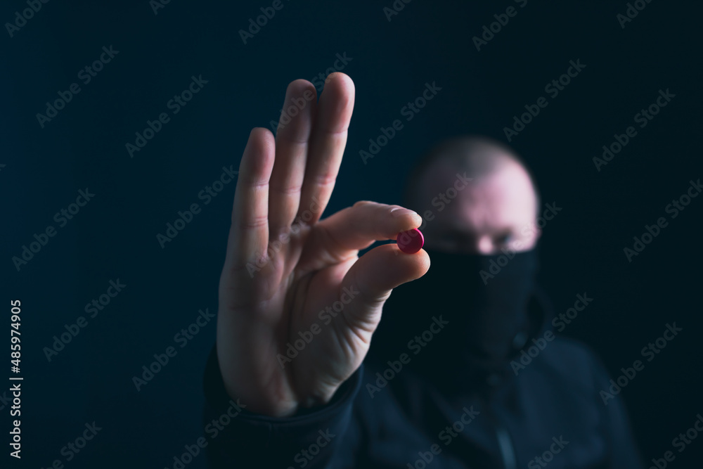 Male silhouette holding drugs, pills, ecstasy. Trafficking crime ...