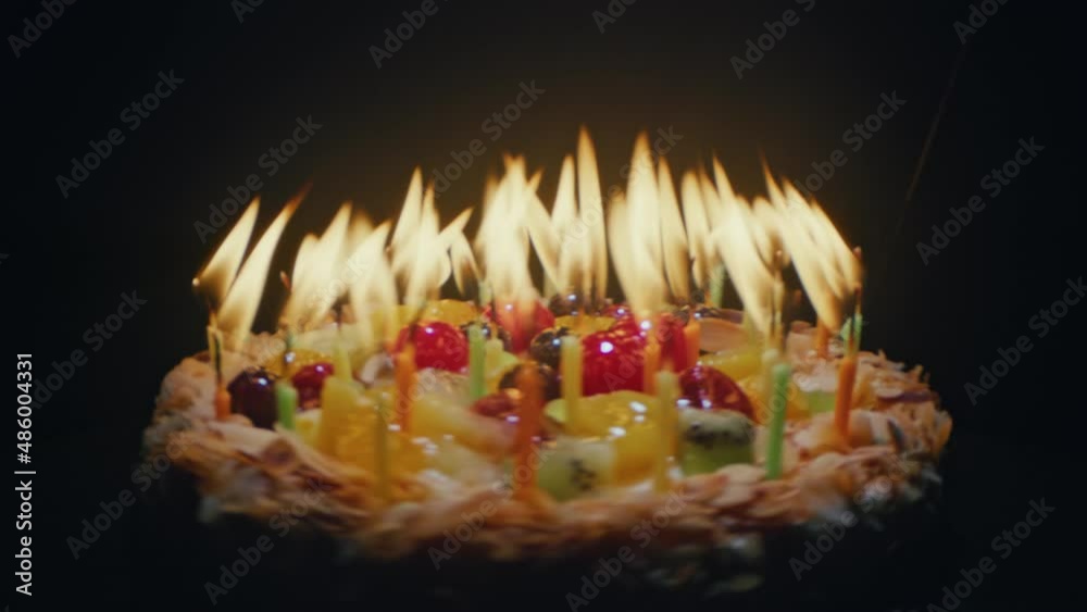 Tracking Macro Extreme Close-Up Shot of birthday cake with a candles ...