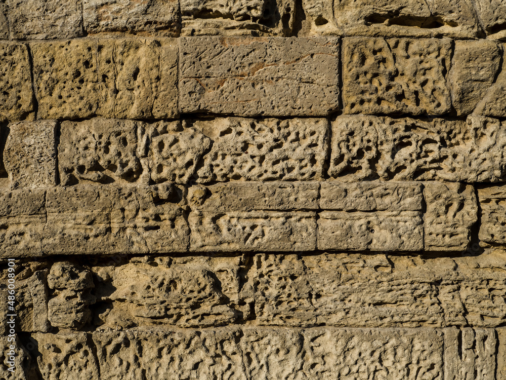 Texture of an ancient stone wall. Pattern of weathered brown bricks ...