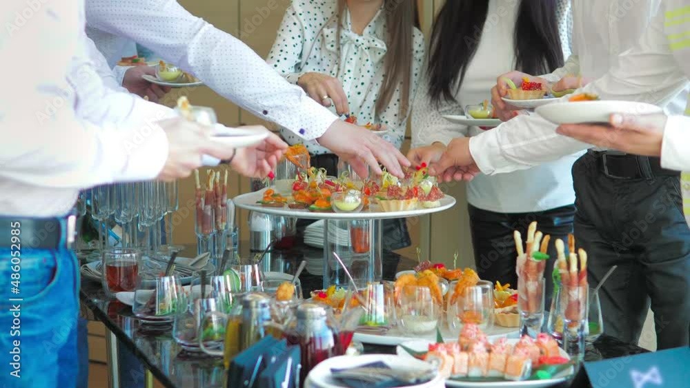Meals for a group of people, buffet in a luxury office, close-up. The ...