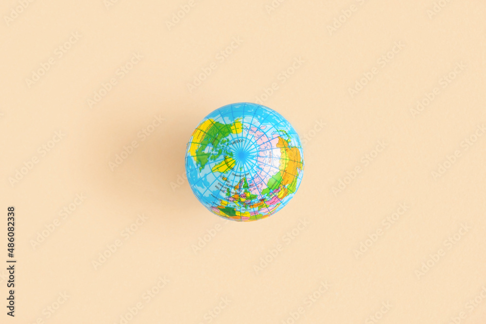 Earth globe on isolated beige pastel background. Abstract wallpaper ...
