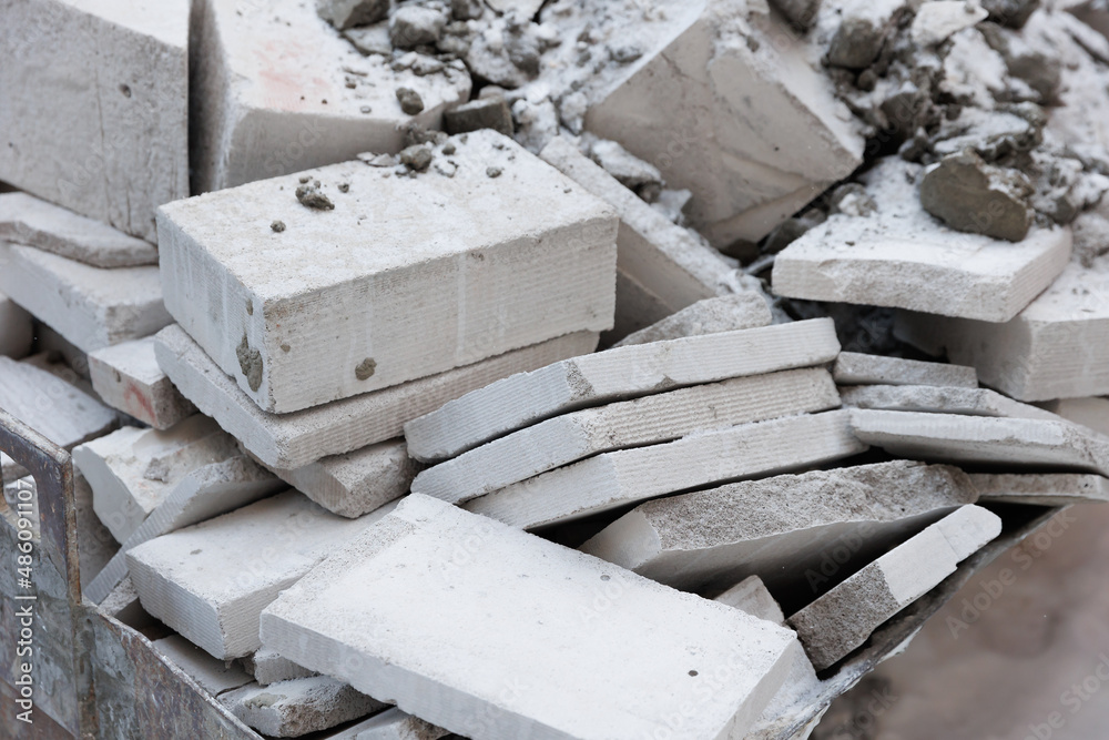 broken brick and the remains of a gas block at the construction site ...