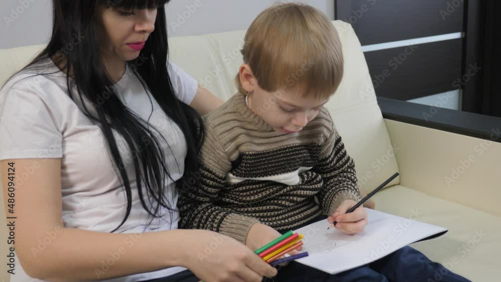 little boy and mom draw teamwork happy family concept. child son with ...