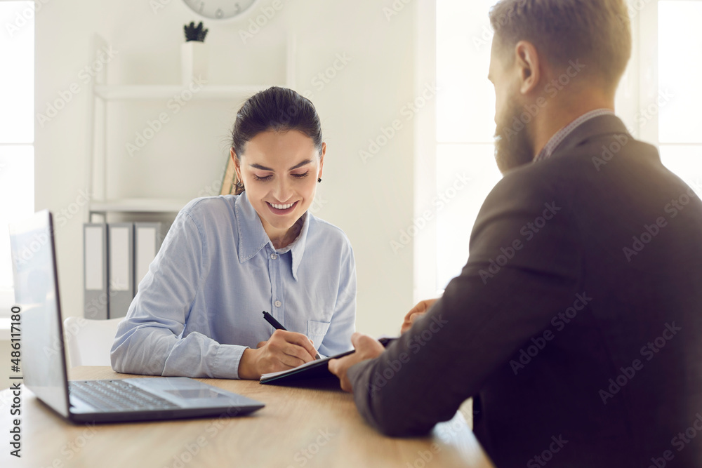 Business contract signing. Happy female client during meeting in office ...