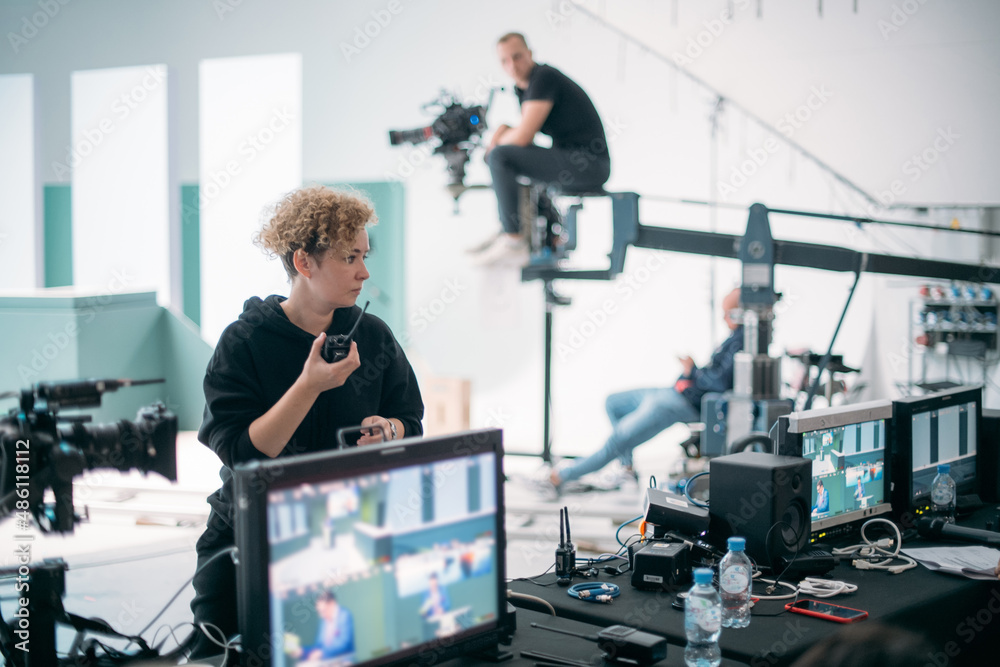 Director at work on the set. The director works with a group or with a ...