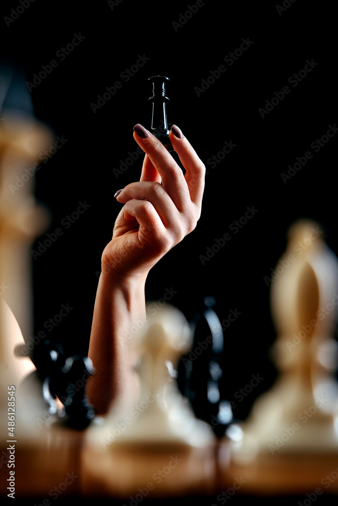 Hand Playing Chess