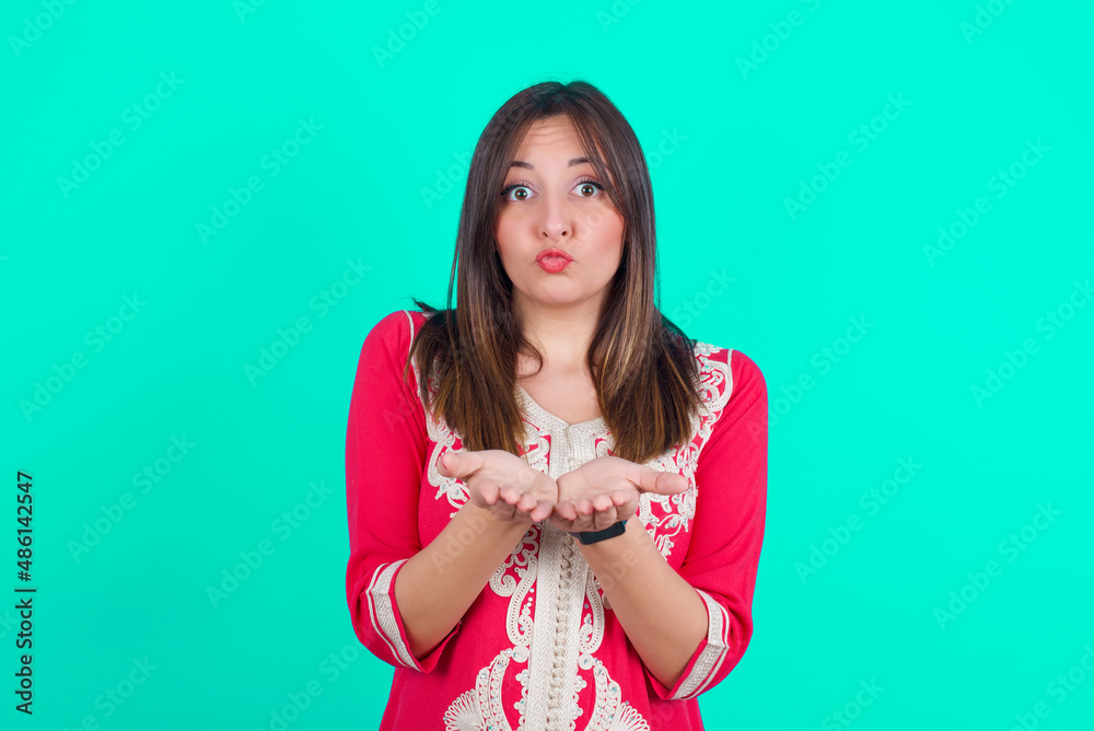 young beautiful moroccan woman wearing traditional caftan dress over ...