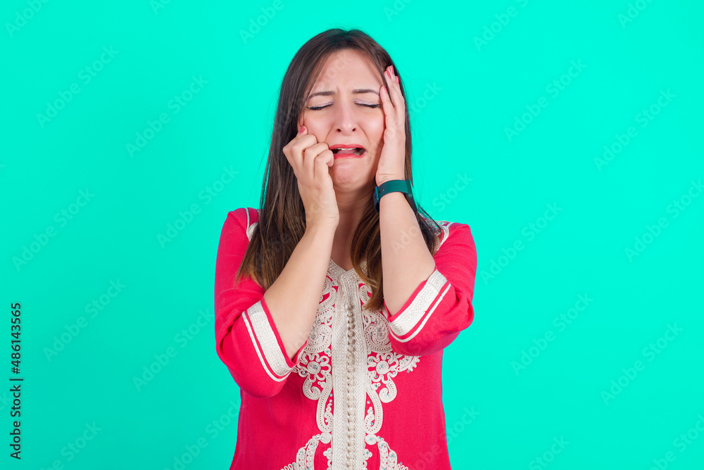 Doleful desperate crying young beautiful moroccan woman wearing ...