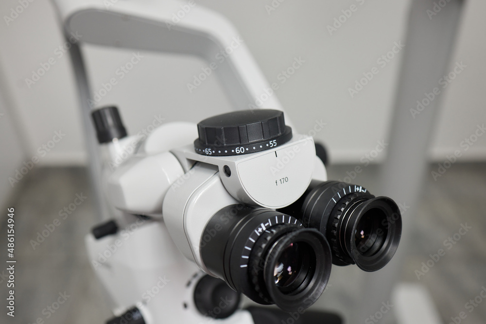 Dental microscope on the background of modern dentistry. Medical ...