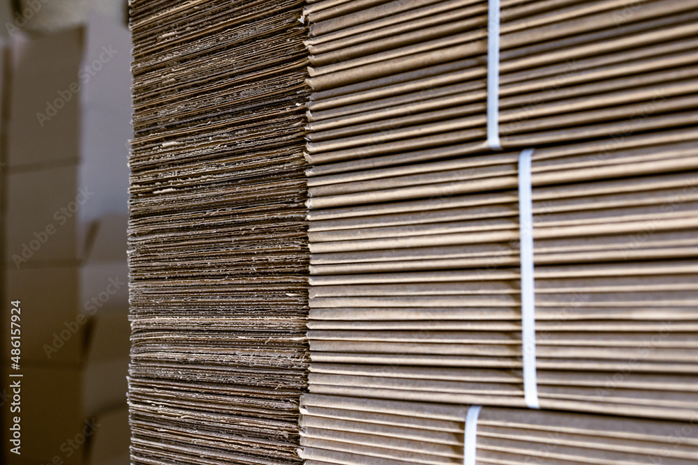 Folding cardboard boxes. Perforated sheets of corrugated cardboard are ...