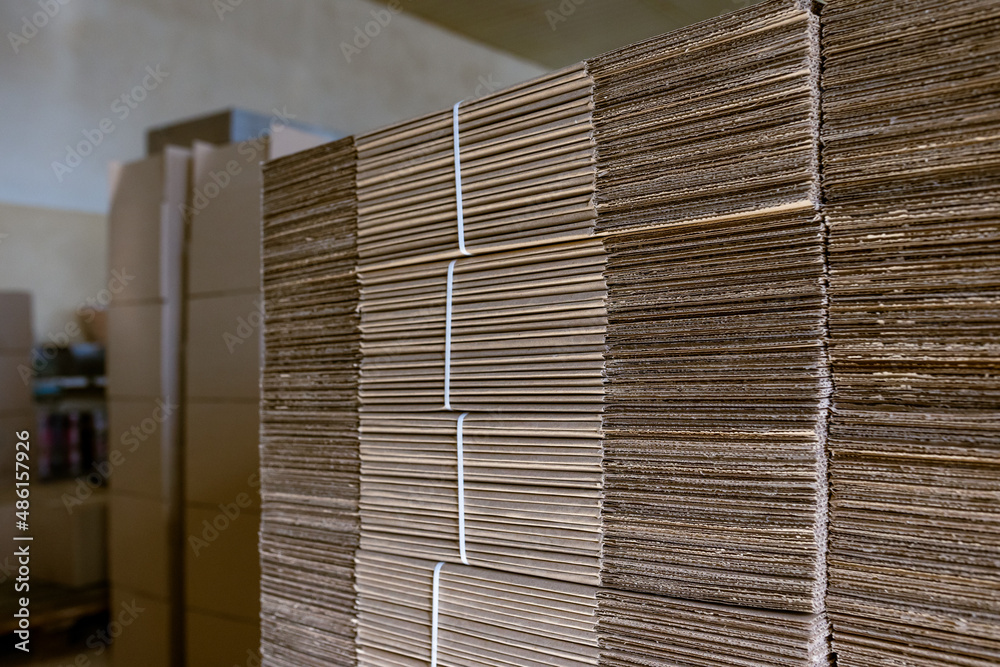 Folding cardboard boxes. Perforated sheets of corrugated cardboard are ...