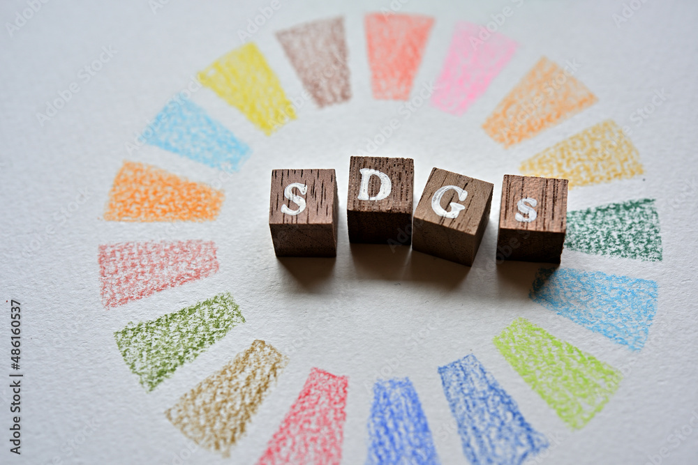 Brown word cube arranged in the word SDGs It's an abbreviation for ...