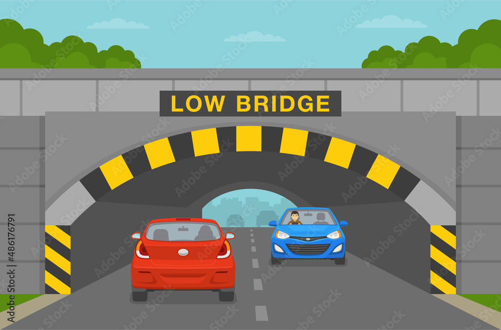 Flow of cars driving into a tunnel of low bridge. Low bridge with ...
