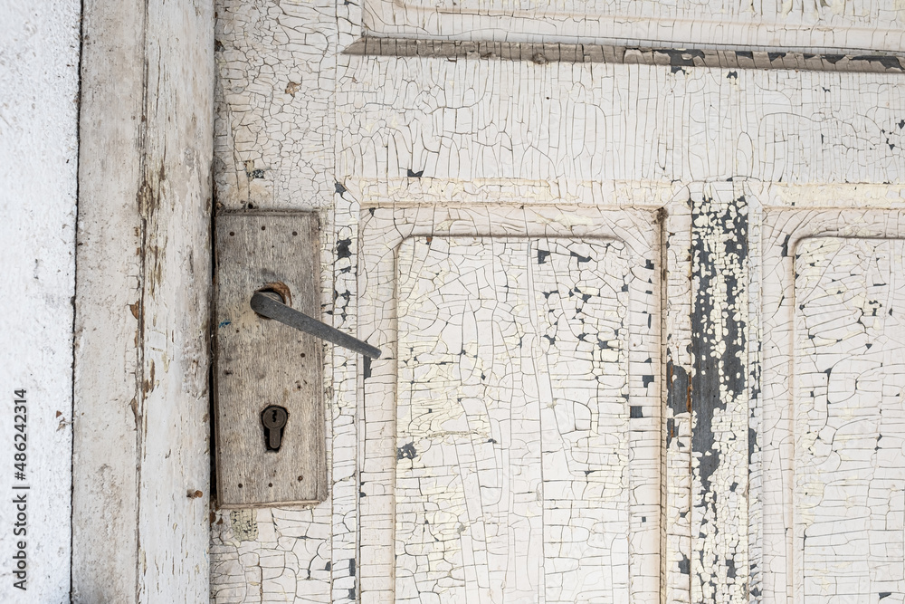 Old front door with cracked texture and damage paint. Close up cracked ...