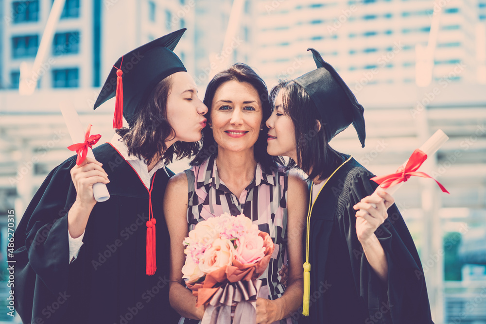 graduation day happy family with girl hold diploma and balloon ...