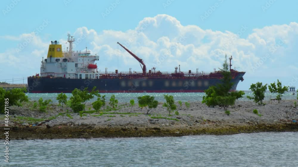 Oil tanker is floating at sea oil port terminal. Oil and gas ...