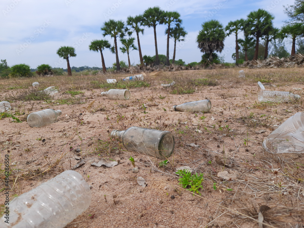 Glass and plastic bottles scattered over the outlying land. Such wastes ...