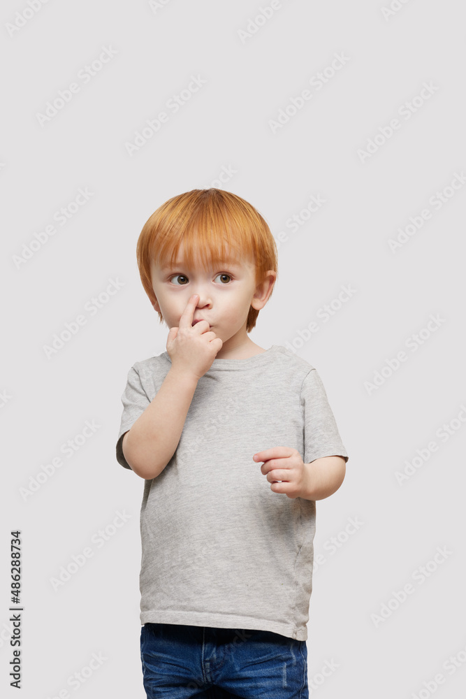 Beautiful redheaded and red-haired child or toddler boy pointing on his ...