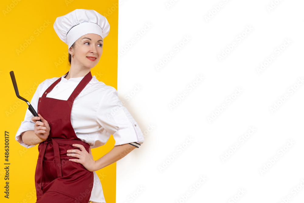 Attractive woman cook. Restaurant chef is smiling. Place for ...