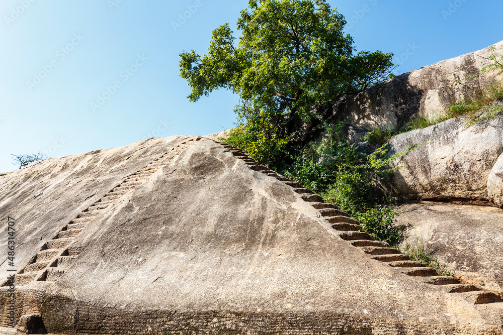 Steps carved out of giant rock in Mamallapuram, Tamil Nadu, South India ...