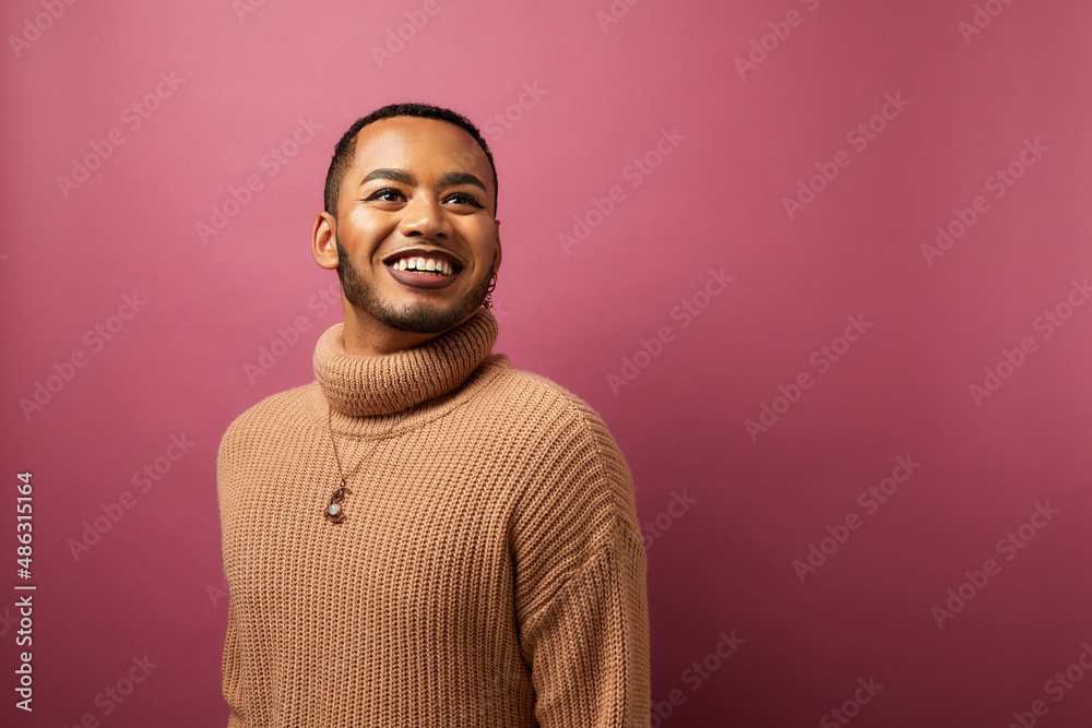 Studio portrait of queer man against purple background Stock Photo ...