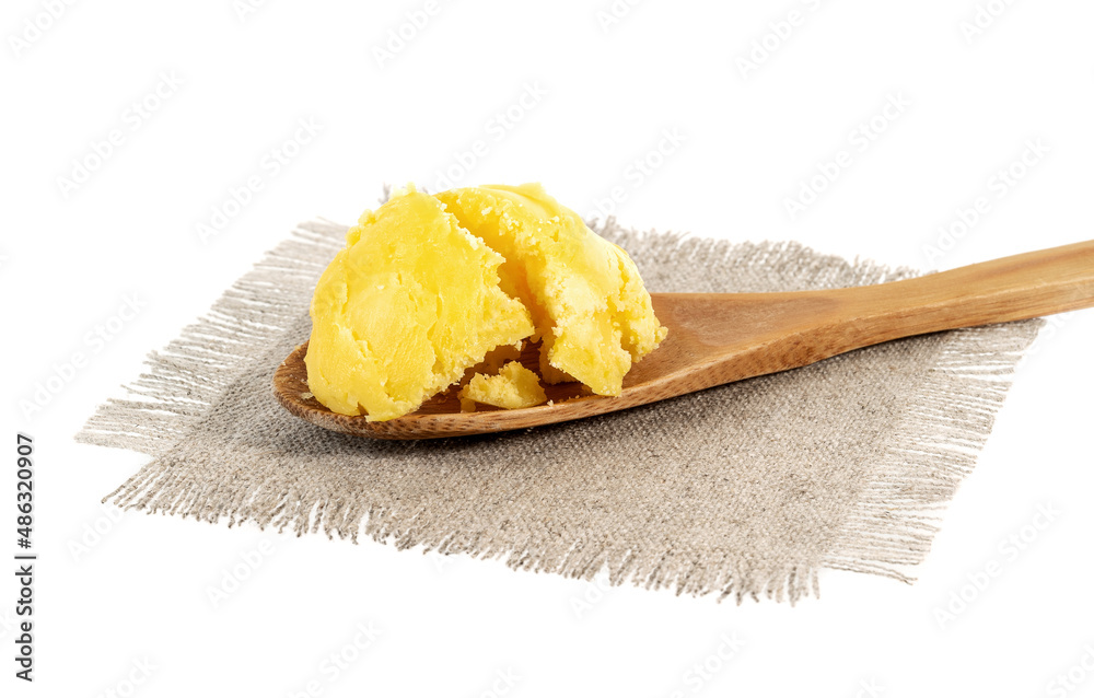 ghee in a spoon on burlap, white background. Pure ghee. Stock Photo ...