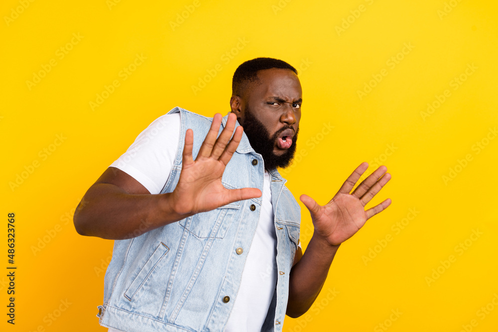 Portrait of attractive worried scared afraid guy showing no stop ...