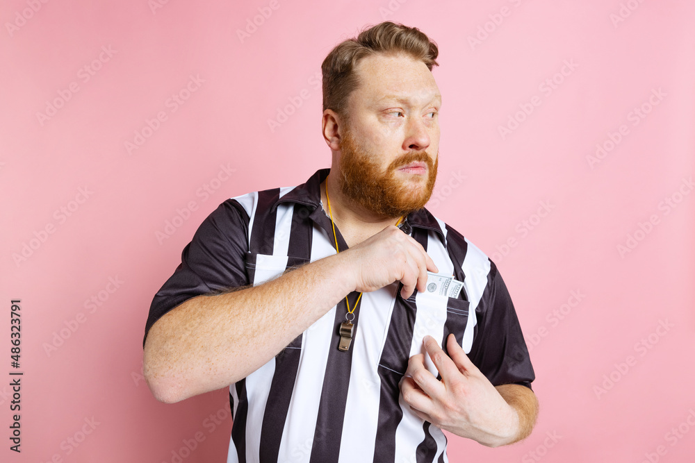 Comic portrait of sport referee wearing field judge uniform isolated on ...