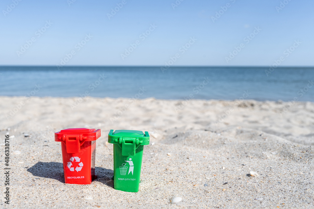 Different colored trash cans red and green with paper, plastic, glass ...
