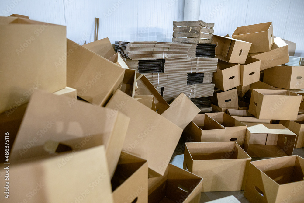 Assembled and disassembled folding cardboard boxes of perforated sheets ...
