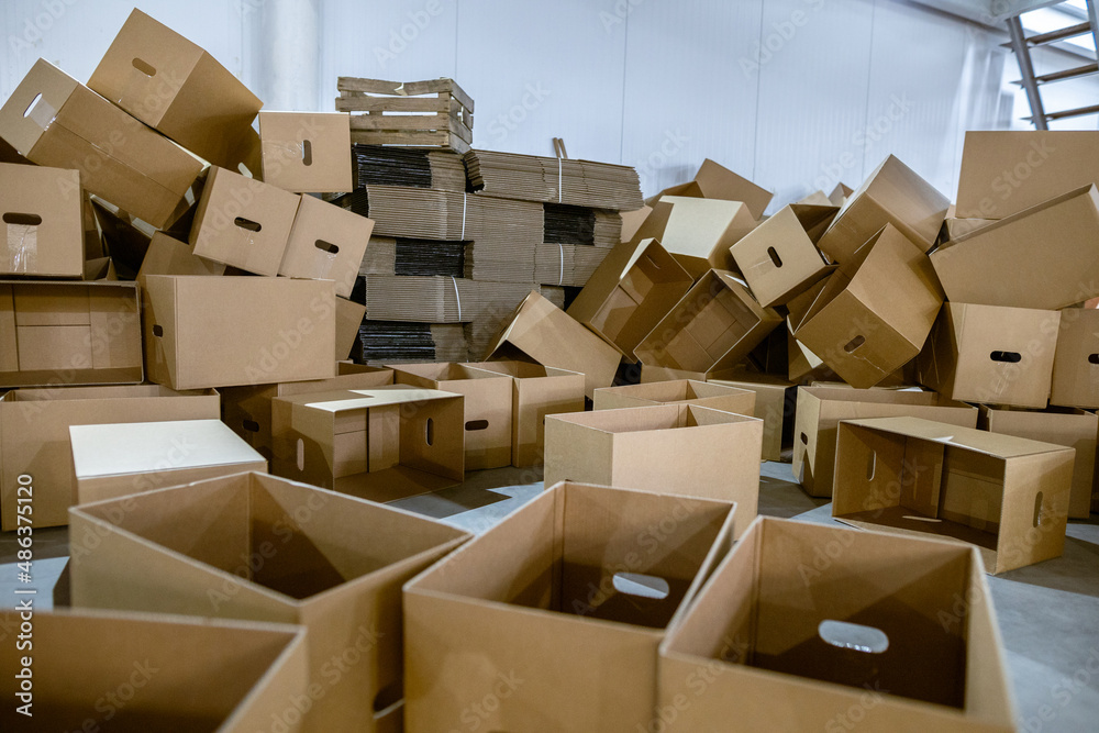 Assembled and disassembled folding cardboard boxes of perforated sheets ...