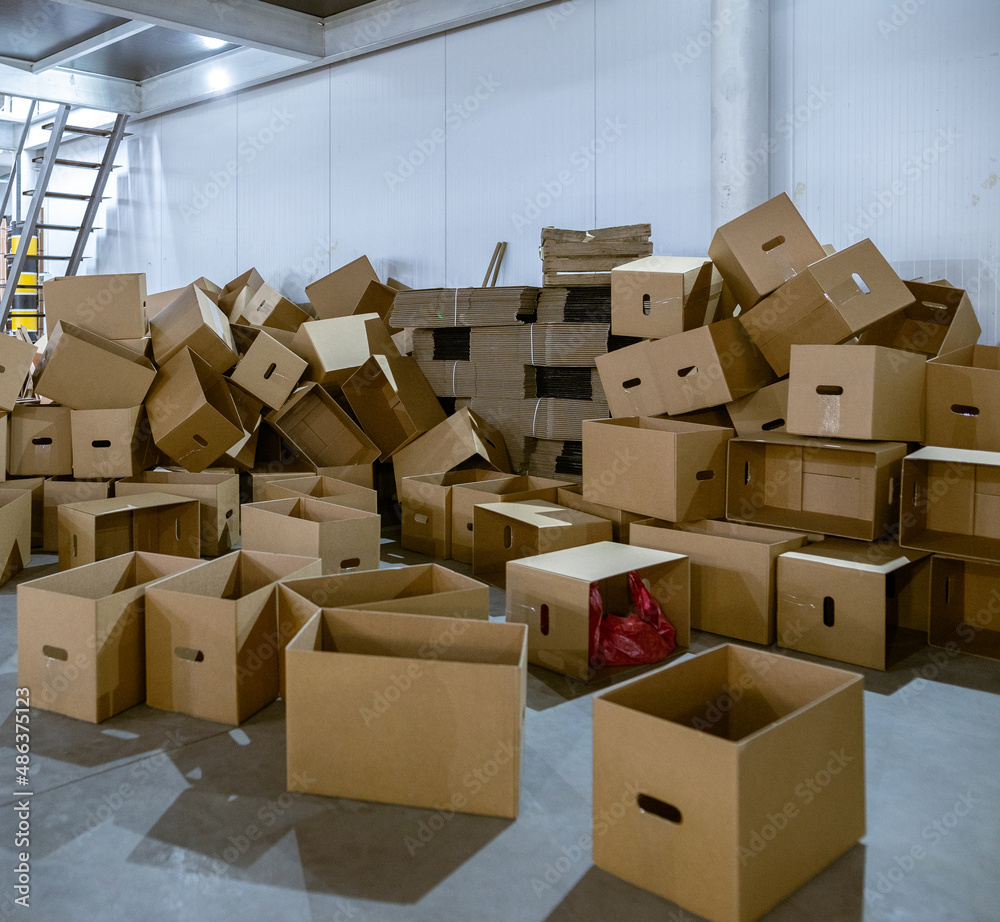 Assembled and disassembled folding cardboard boxes of perforated sheets ...
