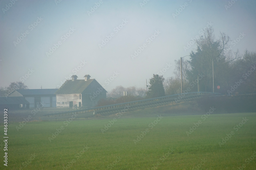 Atmospheric Foggy Rural Landscape with a Classic Wooden Barn. Fog rolls ...
