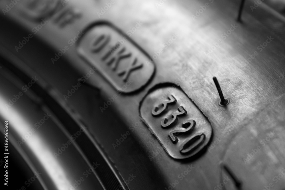 Dot code and date of production of the tire on the sidewall of the ...