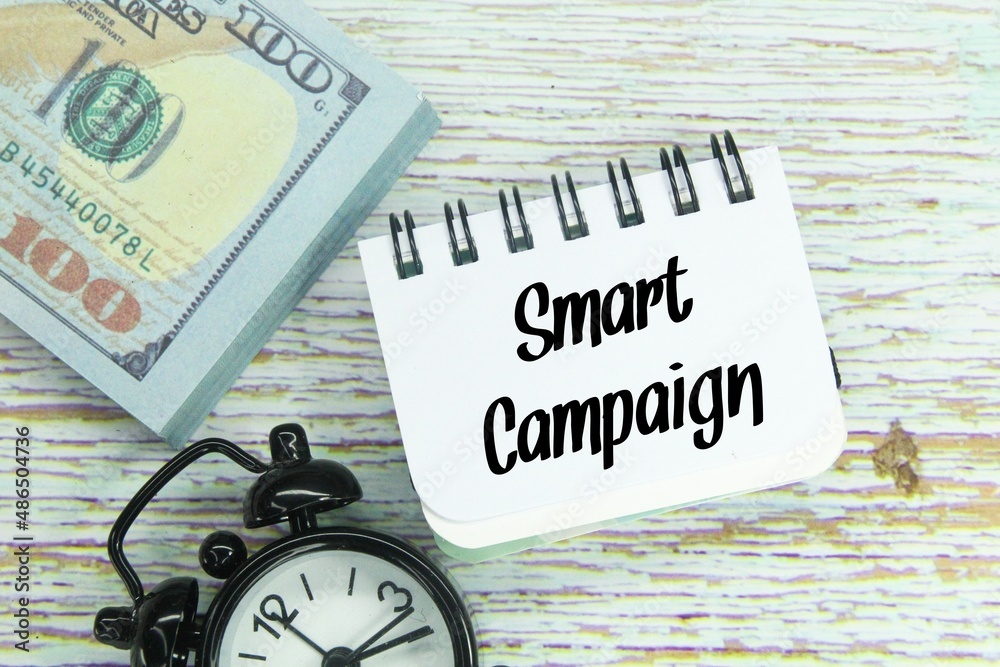 alarm clocks, banknotes and notebooks with the word smart campaign ...