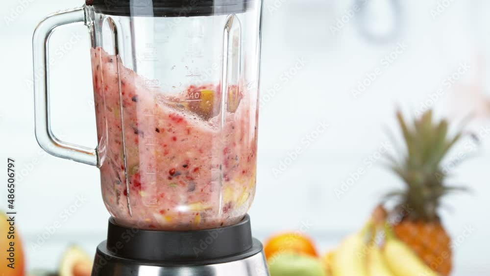 Fresh fruit and vegetables smoothie blended in blender, back view ...