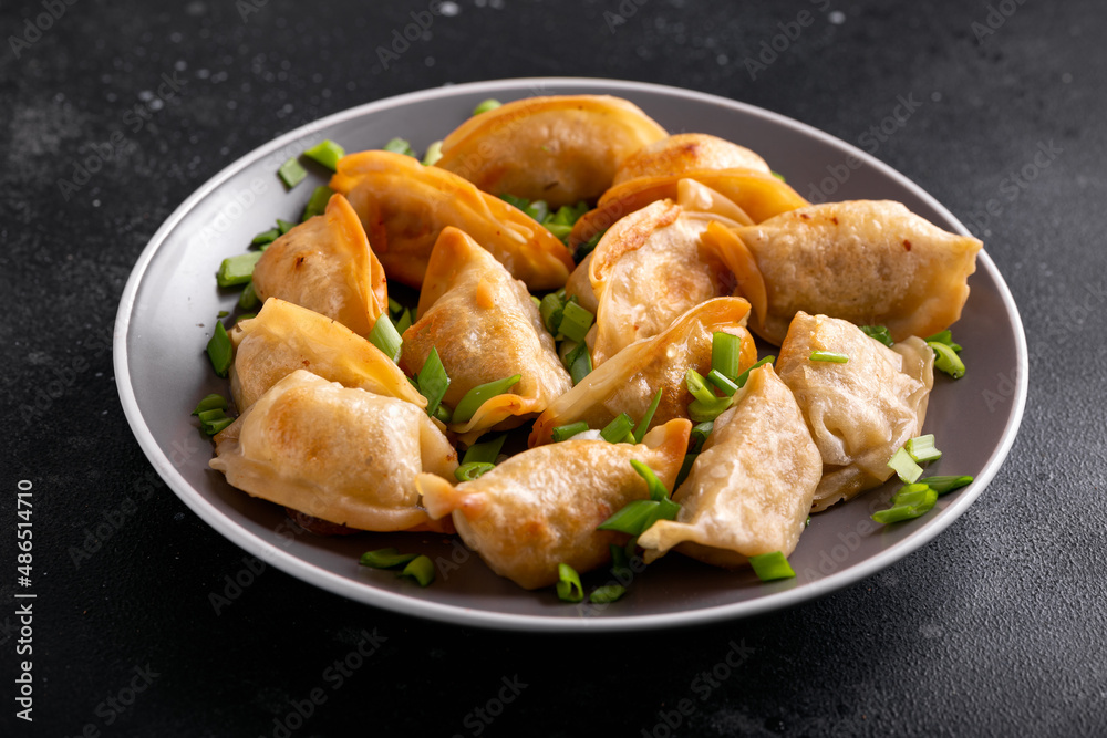 Deep fried crispy gyoza with spring onion. Asian food Stock Photo ...