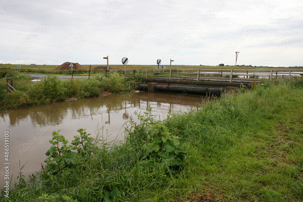 flooded farm and farmland from flash flooding, extreme weather brought ...