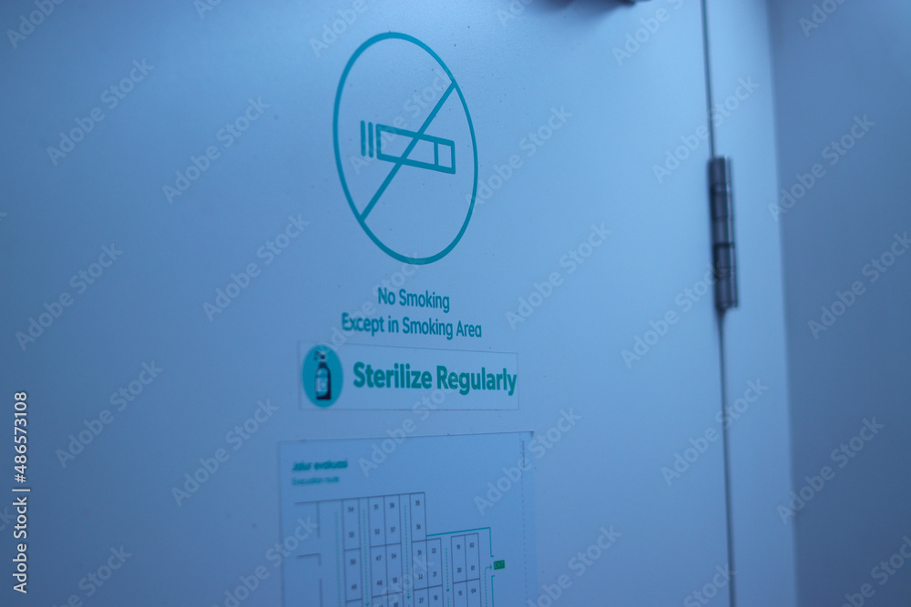 No Smoking Sign (Dilarang merokok) with Sterilize Regularly text and ...