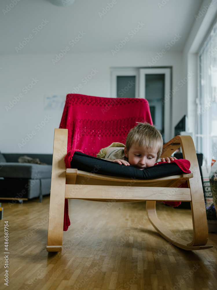 Boy boring rocking chair home indoors fun Stock Photo | Adobe Stock