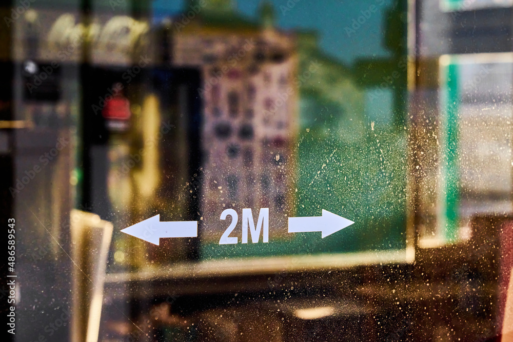 2 metre distance sign in a shop window Stock Photo | Adobe Stock